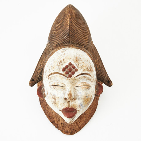A MUKUDJ DANCE MASK, Punu, Gabon, 20th century, cut and painted wood ...