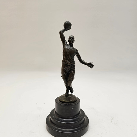 BRONZE SCULPTURE OF A BASKETBALL PLAYER. SIGNED MILO. WITH STAGGERED ...