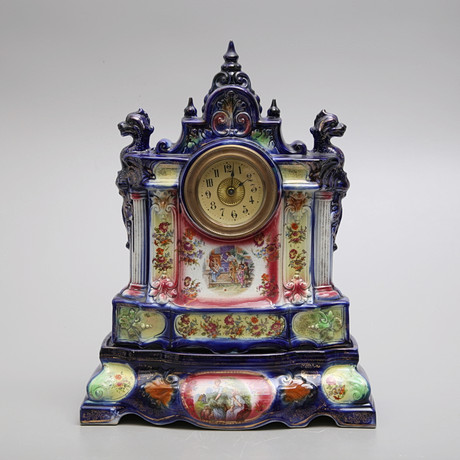 A porcelain table clock on a plinth, Strasburg Ware, England, 18th/20th ...