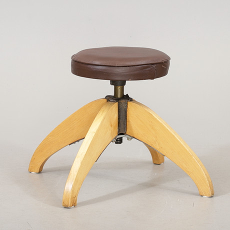 A leather spinning stool, first half of the 20th century. Furniture ...
