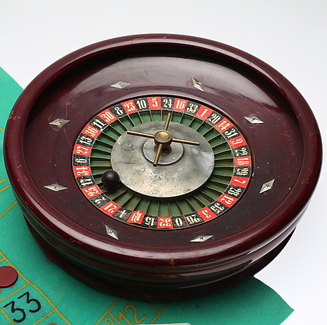 ROULETTE WHEEL with accessories, early 20th century. Miscellaneous ...