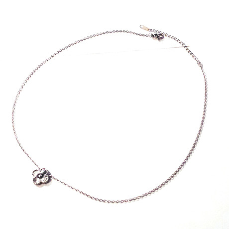 Van Cleef style necklace in steel with flower motif. Jewellery ...