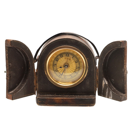 AN EARLY 20TH CENTURY LEATHER CASED TRAVEL CLOCK AND TWO OTHERS. Clocks ...