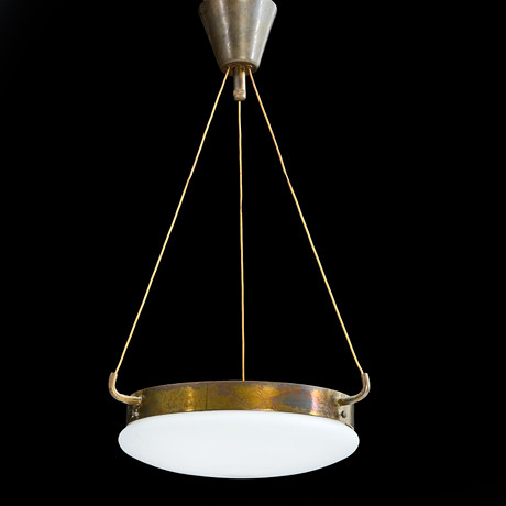 A mid 20th century brass ceiling lamp, cup in white frosted glass ...