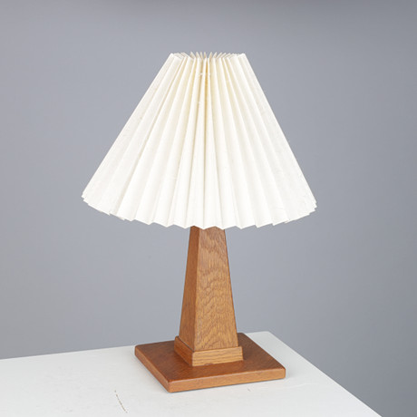 Table lamp made of oak with conical stem and pleated screen, presumably ...