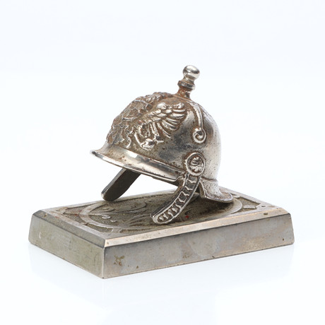 PAPERWEIGHT. Nickel-plated metal. In the form of a helmet/helmet ...