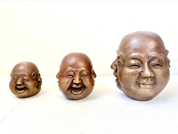 SET OF THREE GRADUATED BRONZE MULTI SIDED ASIAN HEAD SCULPTURES. Art ...