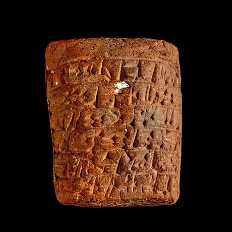 A CUNEIFORM TABLET, Assyria, ca 1500 BC, burnt earthenware, with older ...