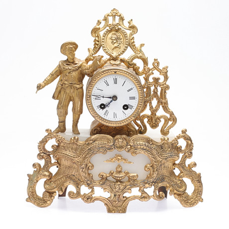 A rococo style metal/alabaster table clock, circa 1900. Clocks ...