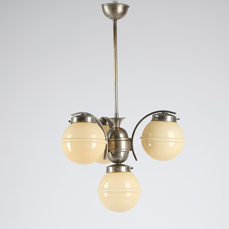 An Art Deco ceiling lamp, white metal and cream-coloured glass cups ...