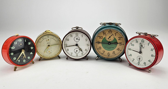 A set of five metal alarm clocks, including Junghans, Gustaf Carlsson ...