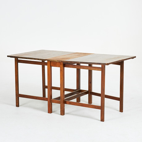 An early 20th century swing table, double gates, stained pine ...