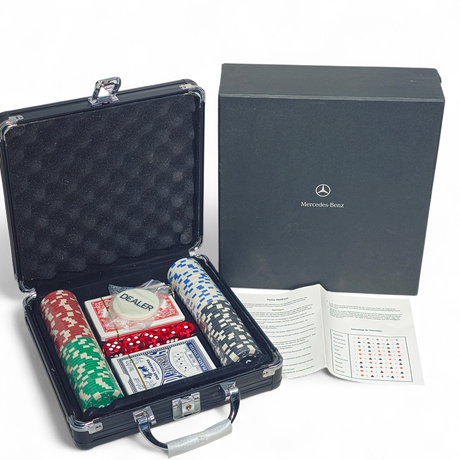MERCEDES BENZ. Texas Hold'em poker card game with chips in a black ...