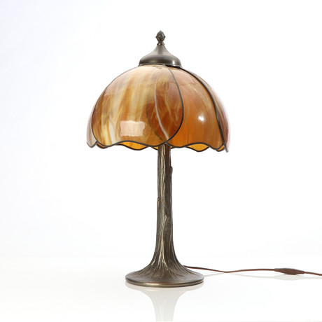 TABLE LAMP. Patinated cast metal, screen with faceted glass. Tiffany ...