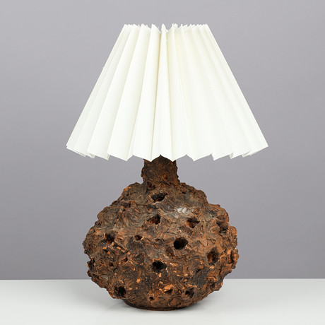 Handmade table lamp in unglazed ceramic with perforations, presumably ...