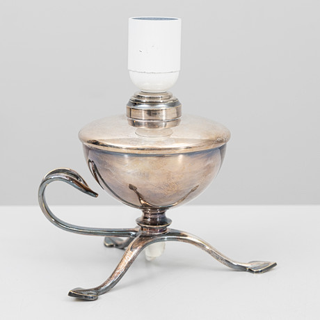 A table lamp, nickel silver, in the form of an oil lamp, mid 20th ...