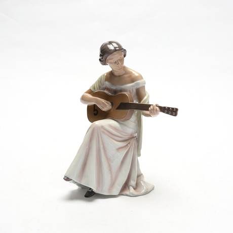 INGEBORG PLOCKROSS IRMINGER. A porcelain figurine of a woman with a ...