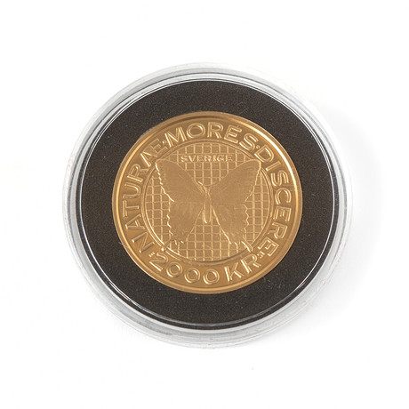 A coin, 21,6K gold, 2000 kr, Carl von Linnaeus 1707 - 2007. Coins ...