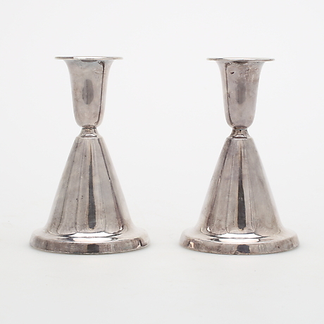CANDLE STICKS, a pair, silver, total weight with filling 304.94 grams ...