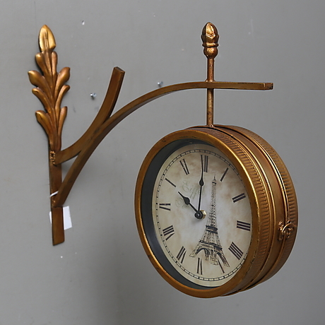 WALL CLOCK, double-sided, brass-coloured forging, 1900/2000s. Clocks ...