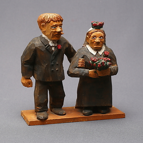GROUP OF FIGURES, Bride and groom, carved and painted wood, signed HG ...