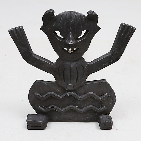 FIRE DOG in the form of a devil, cast iron, 20th century. Silver ...