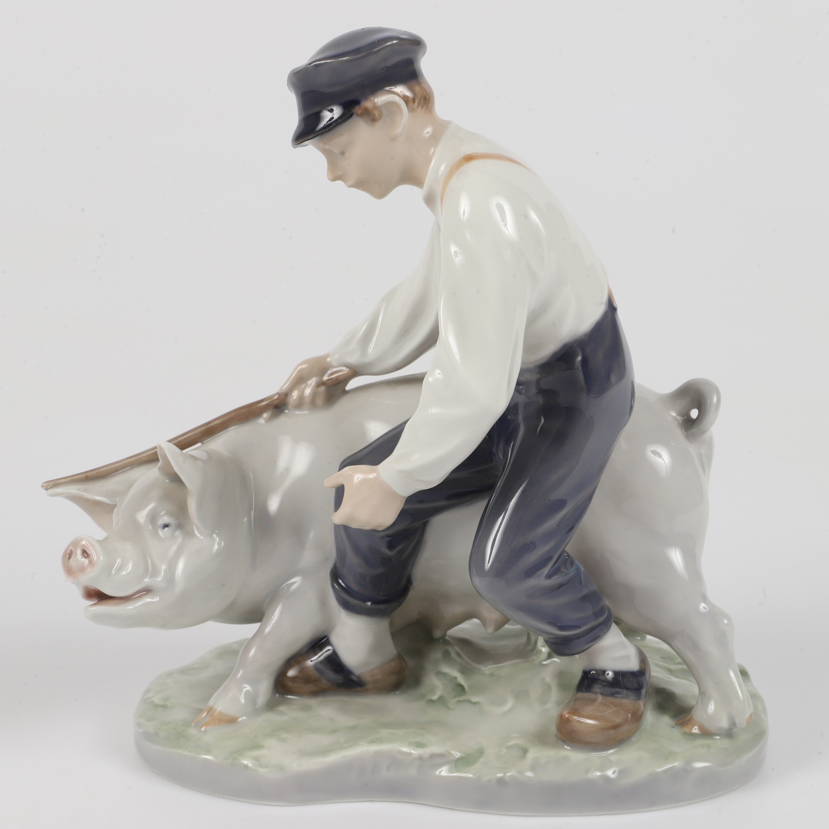 Images for 2398773. FIGURINE, boy with pig, Royal Copenhagen. - Auctionet