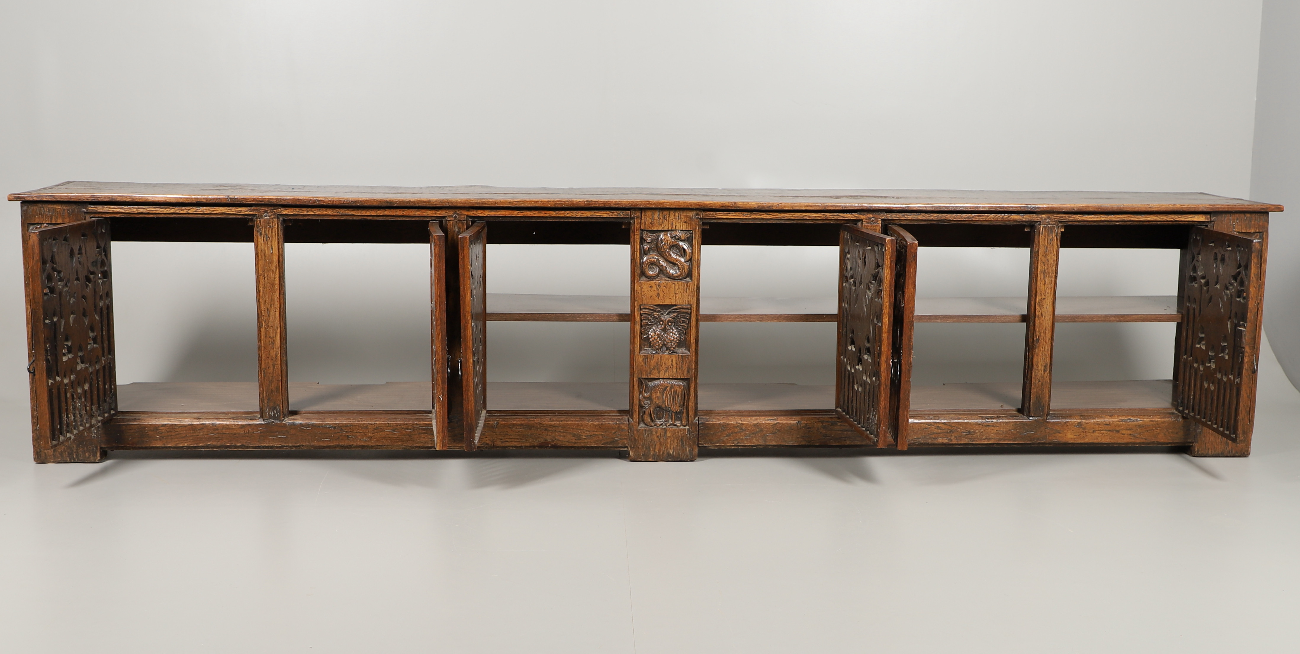 Images for 2865797. A GOTHIC STYLE CARVED OAK LONG CUPBOARD. - Auctionet