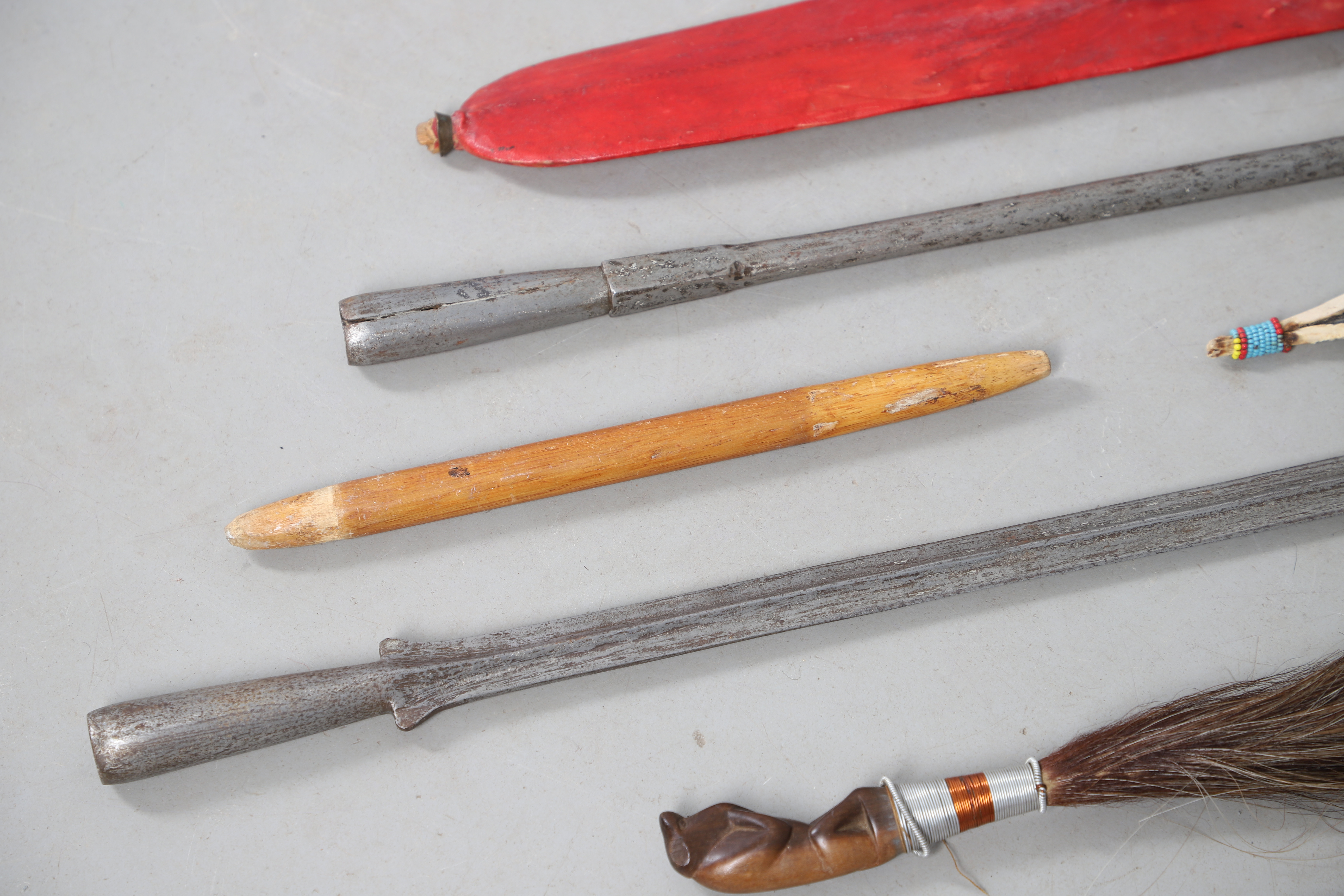 A COLLECTION OF AFRICAN EDGED WEAPONS AND OTHER ITEMS. Weapons ...